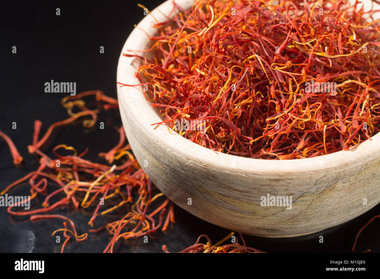 Macro collection, expensive real dried saffron spice close up on black ...