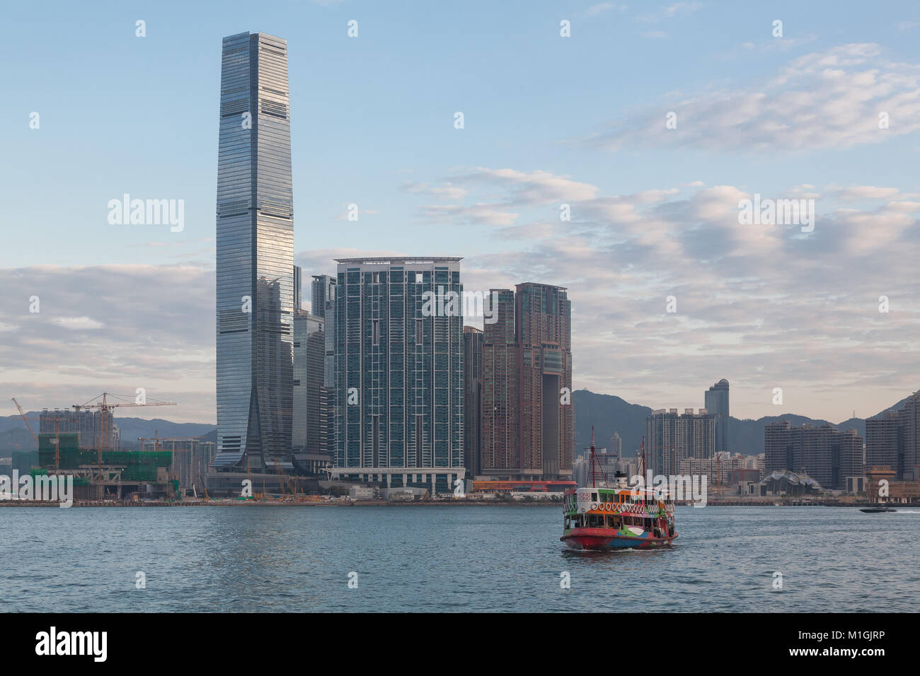 A Star Ferry crossing Hong Kong Bay in front of the International ...