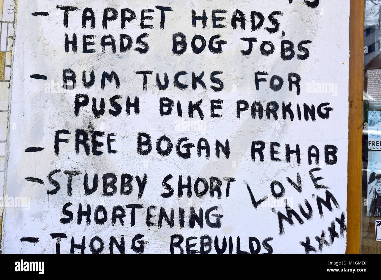 controversial graffiti on shop wall Stock Photo - Alamy