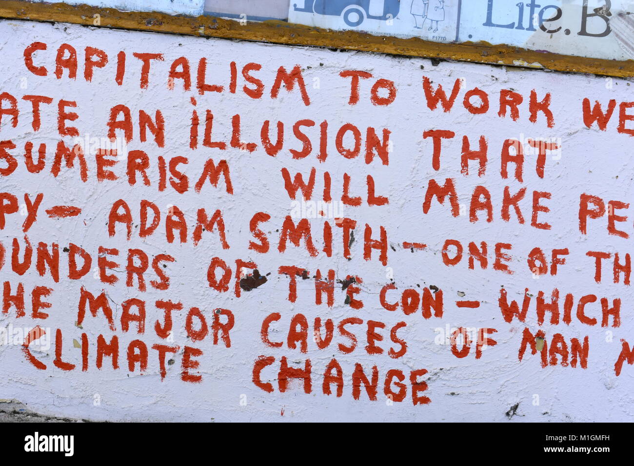 controversial graffiti on shop wall Stock Photo - Alamy