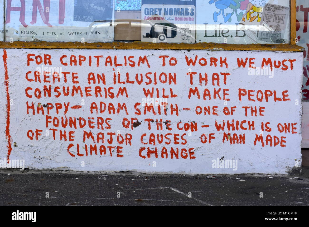 controversial graffiti on shop wall Stock Photo - Alamy