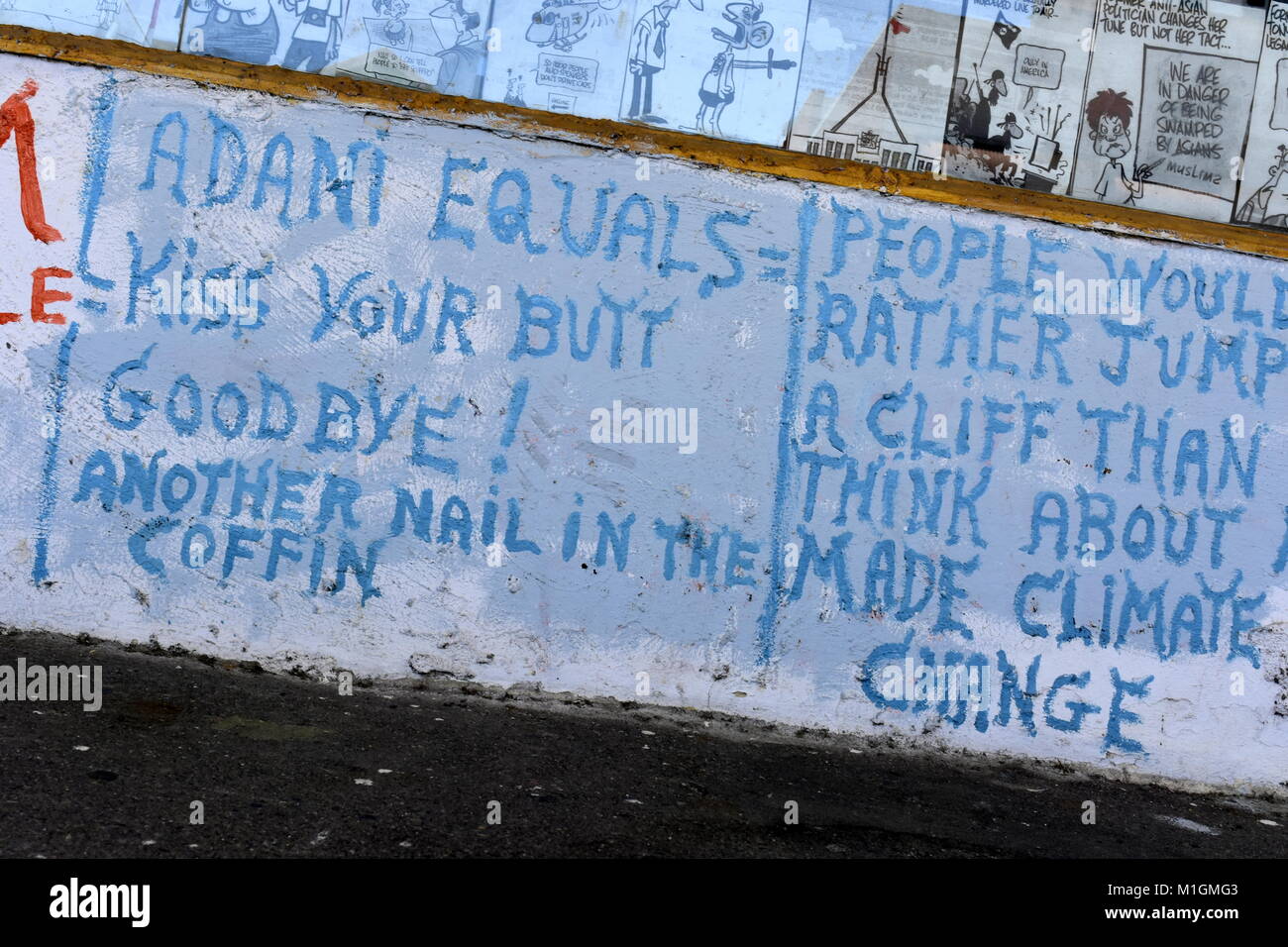 controversial graffiti on shop wall Stock Photo - Alamy