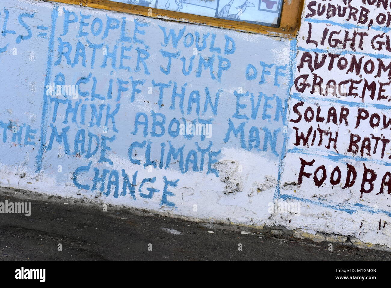 controversial graffiti on shop wall Stock Photo - Alamy