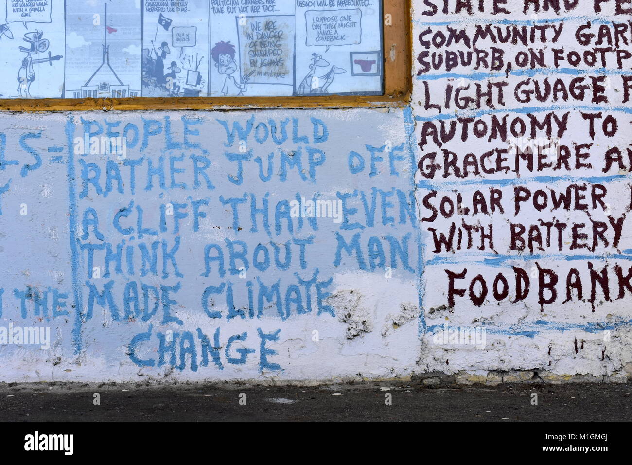 controversial graffiti on shop wall Stock Photo - Alamy