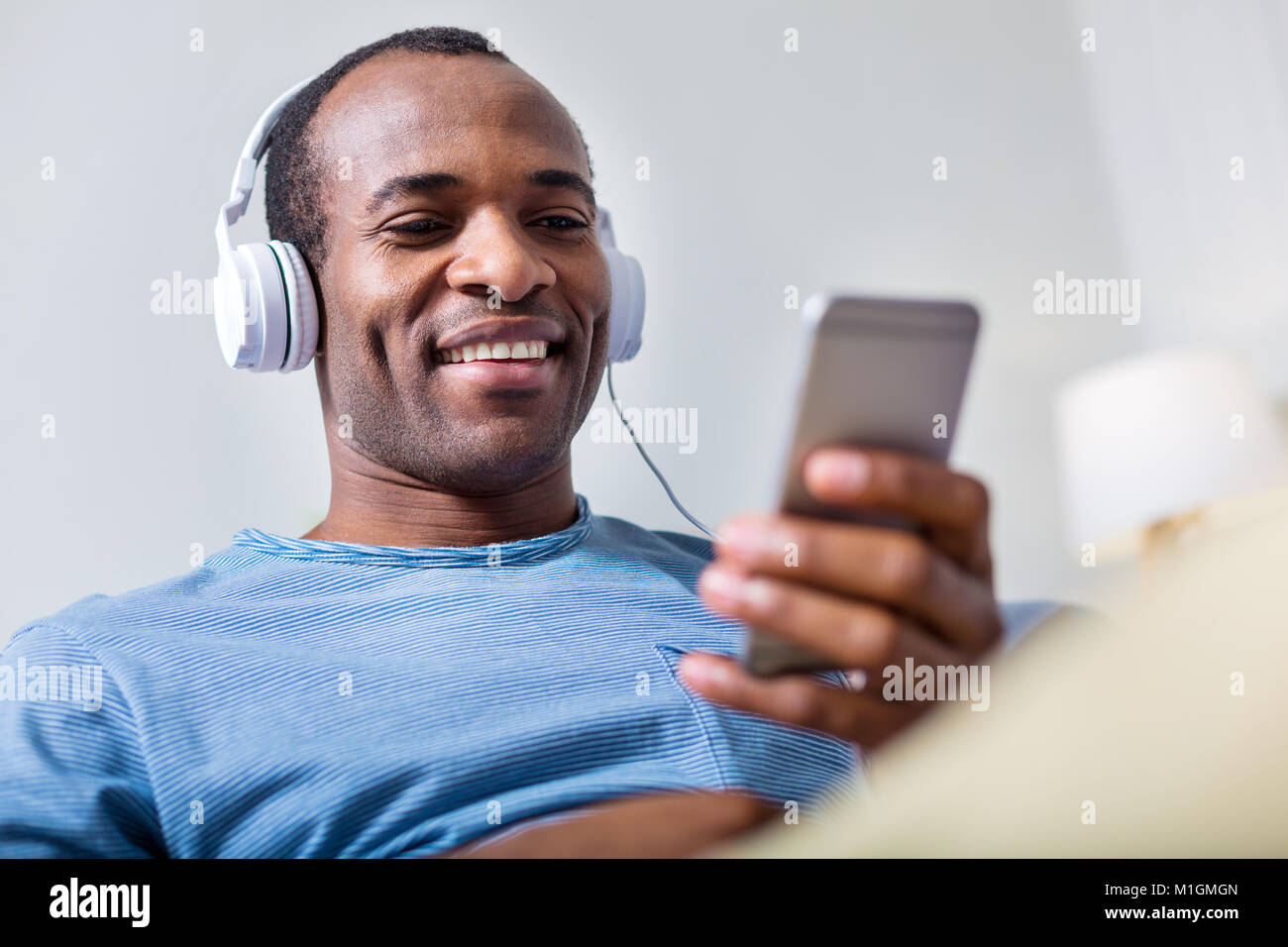 Cheerful happy man enjoying the music Stock Photo - Alamy