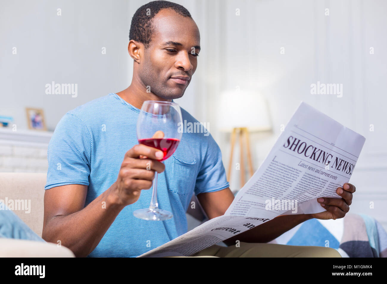 Pleasant nice man drinking alcohol Stock Photo - Alamy