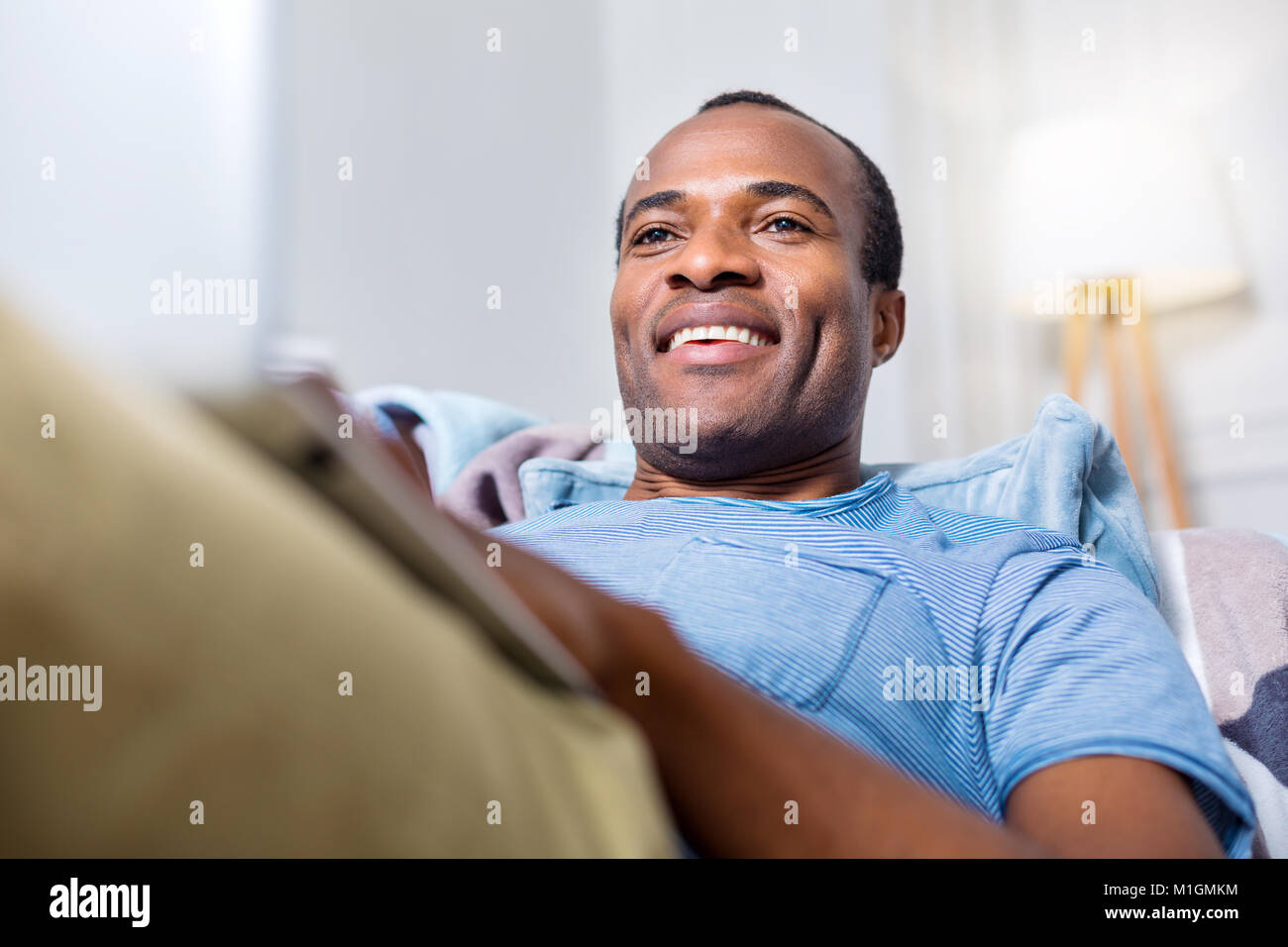 Joyful handsome man enjoying his free time Stock Photo - Alamy
