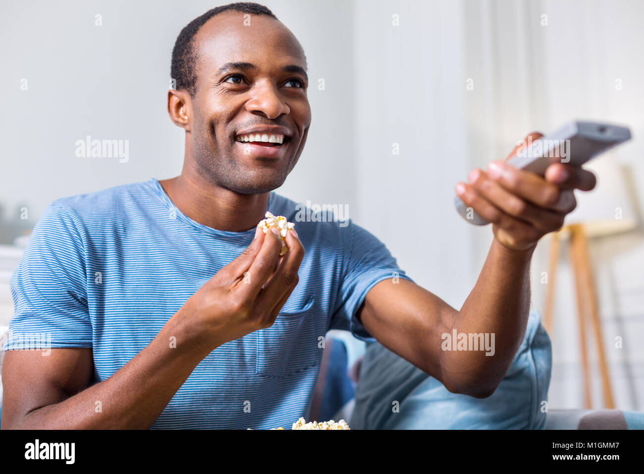 Man eating popcorn hi-res stock photography and images - Alamy
