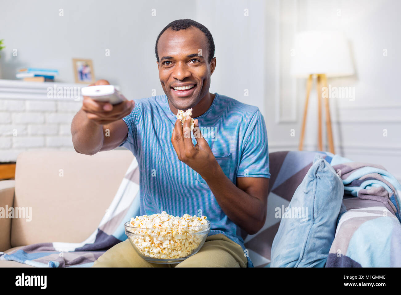 Eating popcorn man hi-res stock photography and images - Alamy