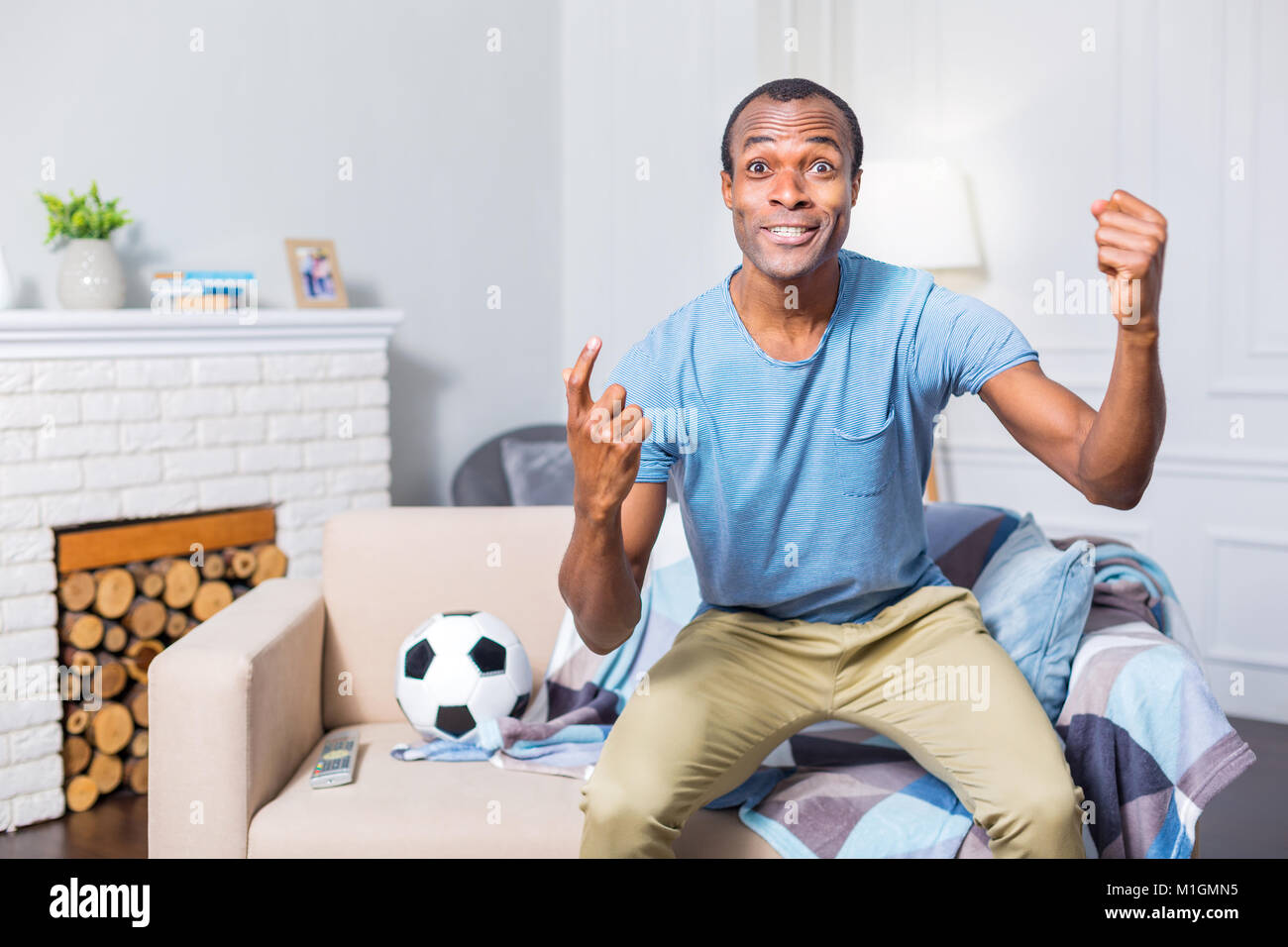 Positive emotional man showing his support Stock Photo - Alamy