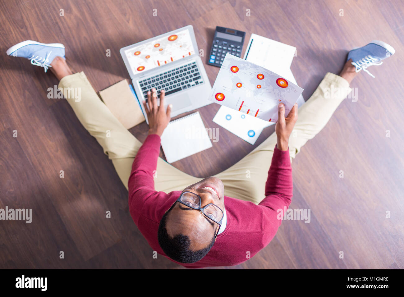 Happy hard working man looking at you Stock Photo - Alamy