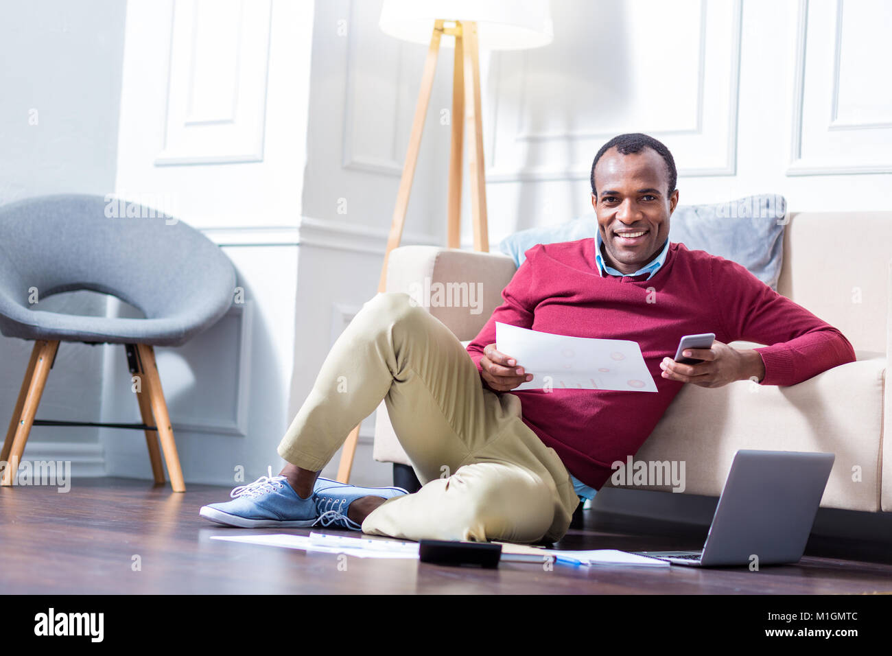 Smart positive man working at home Stock Photo - Alamy