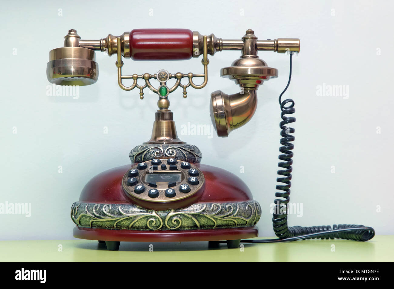 Old vintage telephone . Old fashioned phone over white . Bunch of ...