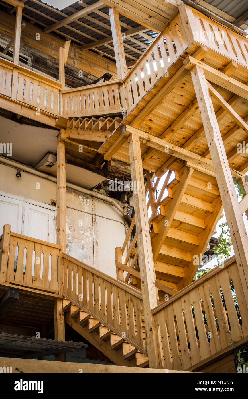 Wooden staircase to the upper floors of a private multi-storey building ...