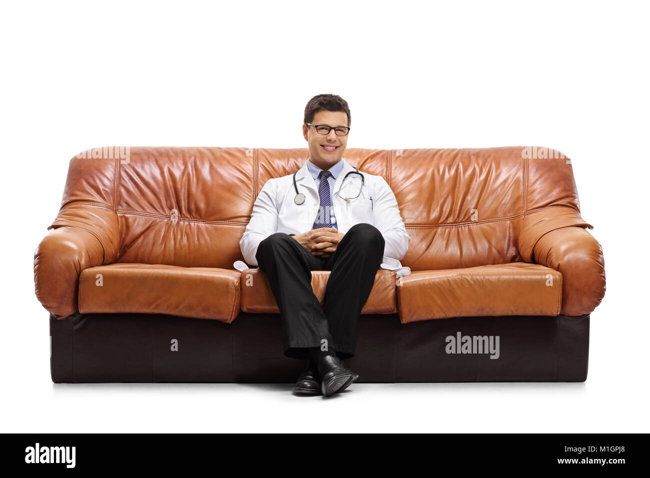 Doctor sitting on a leather sofa isolated on white background Stock ...