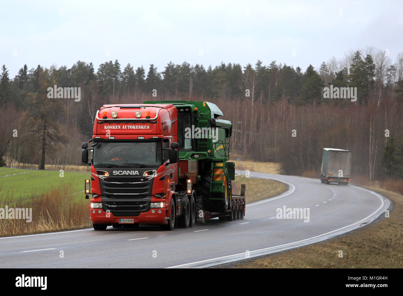SALO, FINLAND - JANUARY 26, 2018: Scania R580 semi hauls John Deere ...