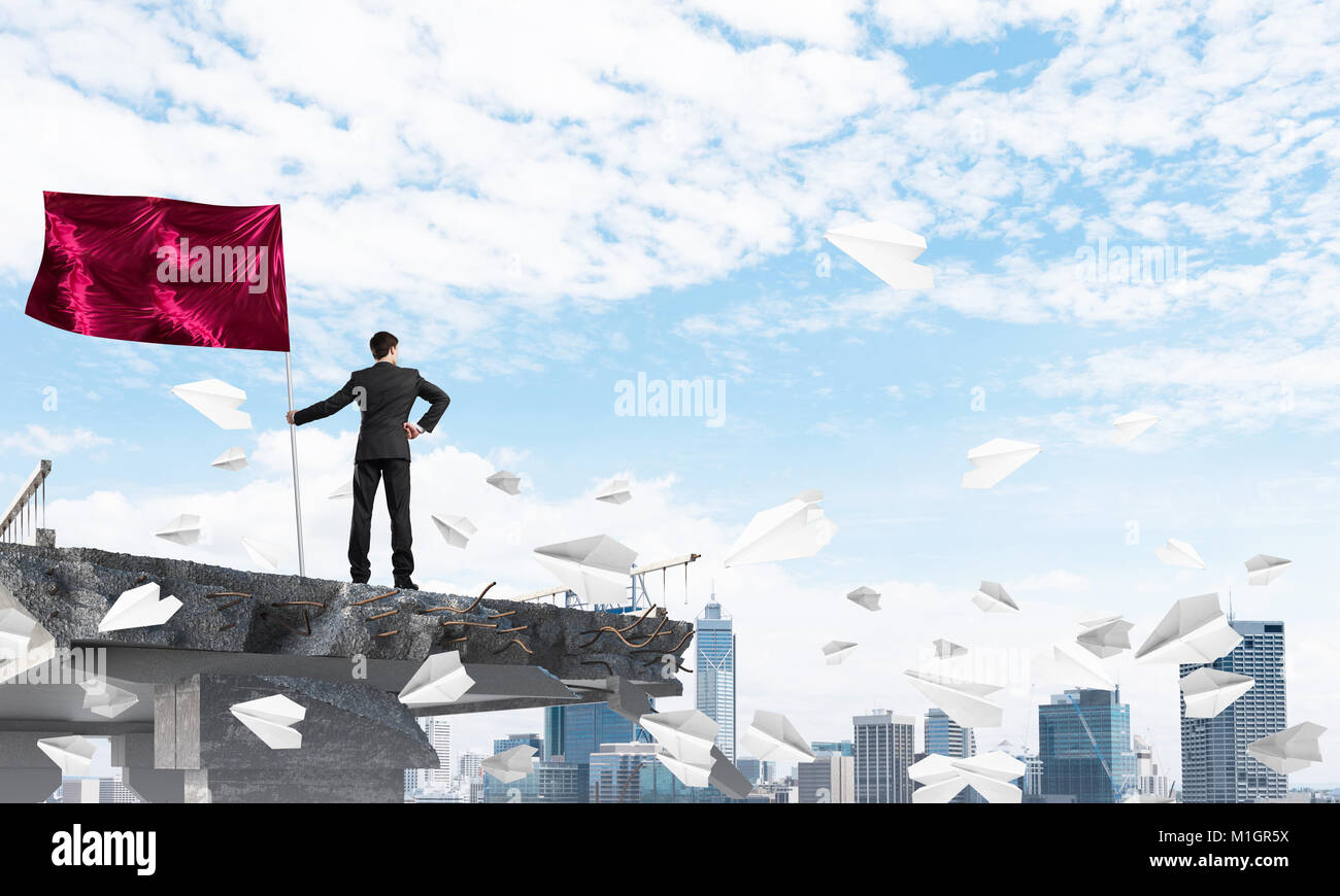 Man with flag presenting leadership concept Stock Photo - Alamy