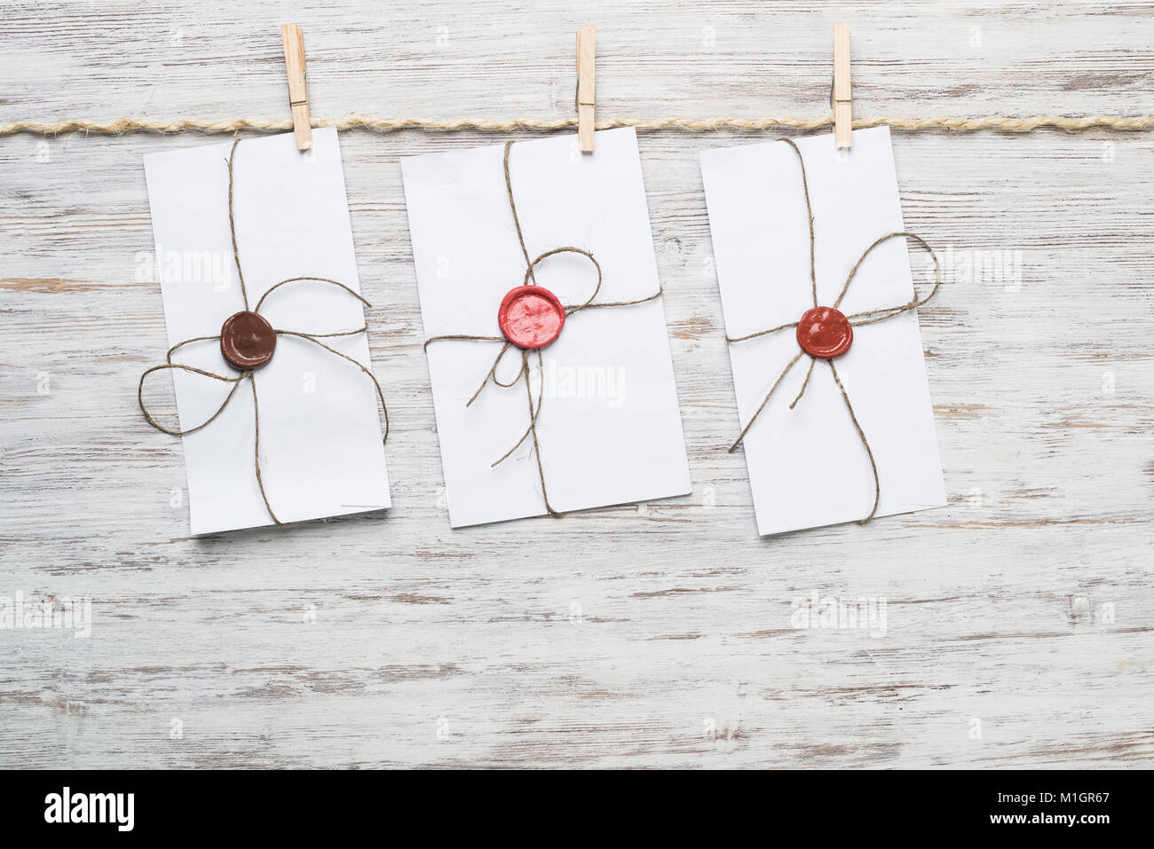 Mail envelope on rope Stock Photo - Alamy