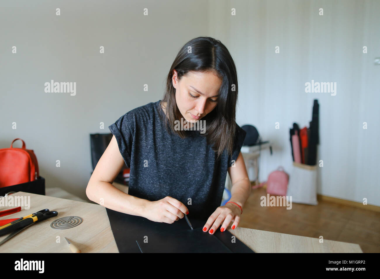 young designer making women bags for sale Stock Photo - Alamy