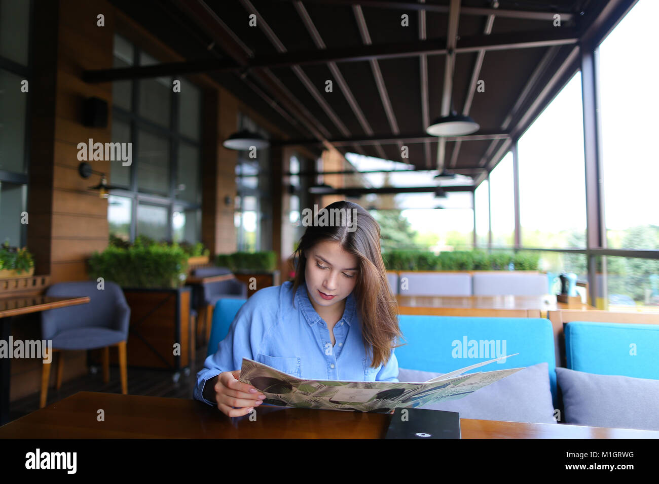 Person flipping through restaurant menu hi-res stock photography and ...