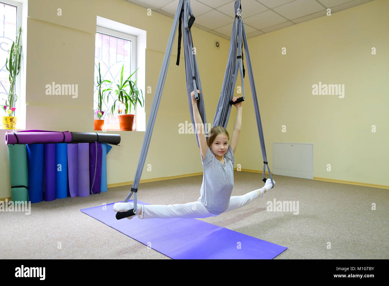 Little girl performs in air acrobatic elements Stock Photo - Alamy