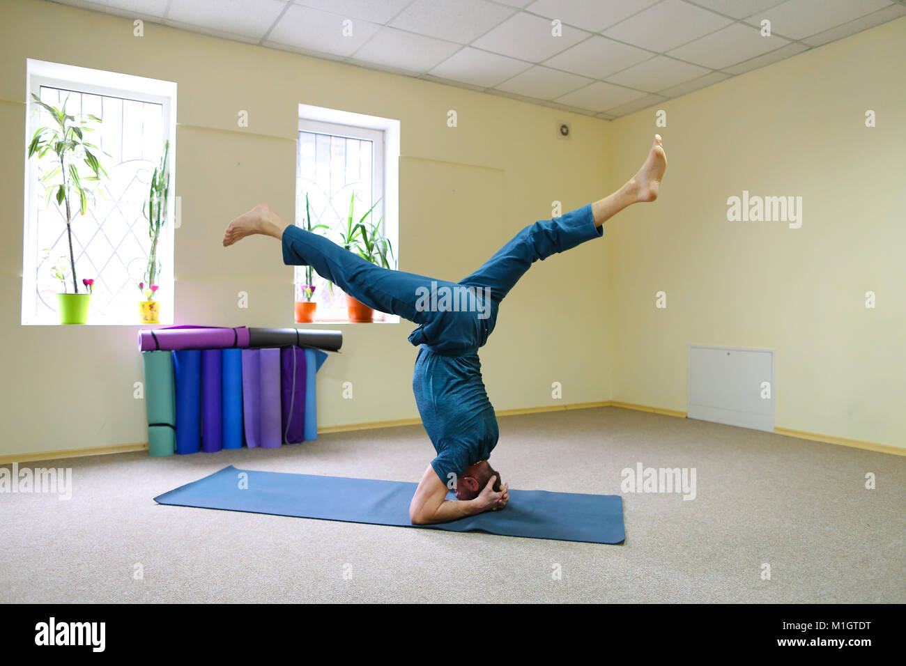 Beautiful young American performs asanas from yoga Stock Photo - Alamy