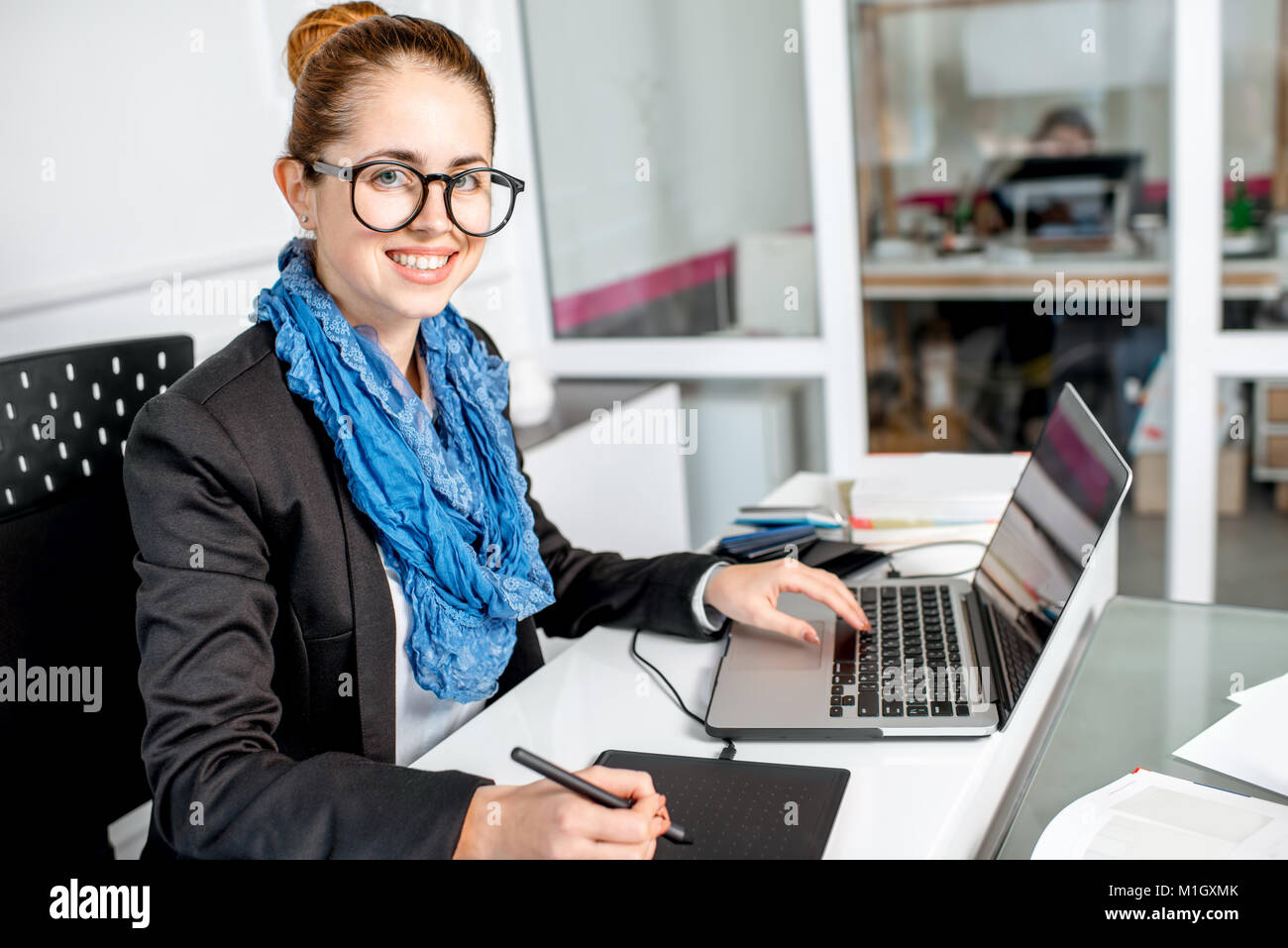 Creative woman in the office Stock Photo - Alamy
