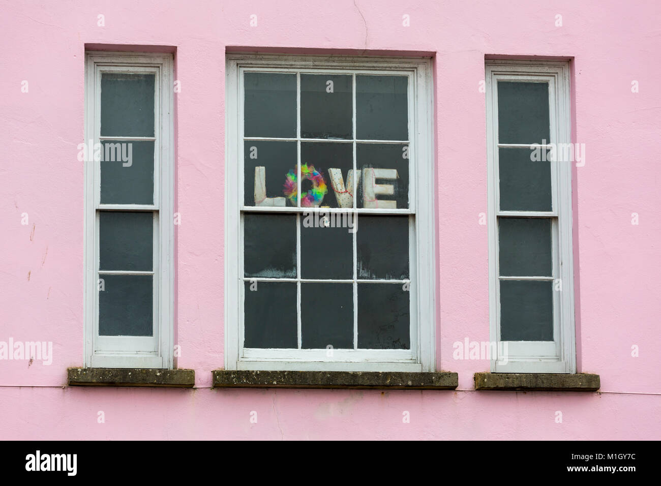 Romantic sign saying LOVE in a window in a window Stock Photo - Alamy