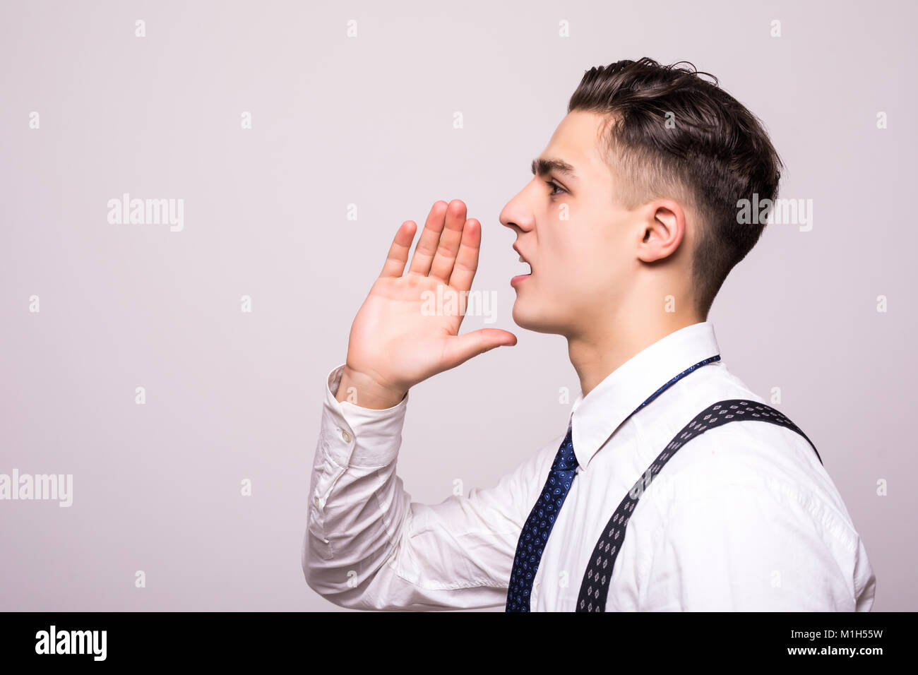 Closeup side view profile portrait, angry upset young man, worker ...