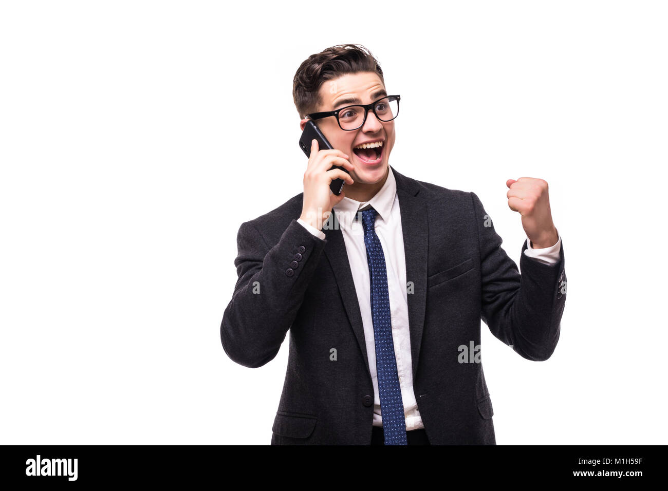 caucasian business person talking on cellphone, excited, rejoicing ...