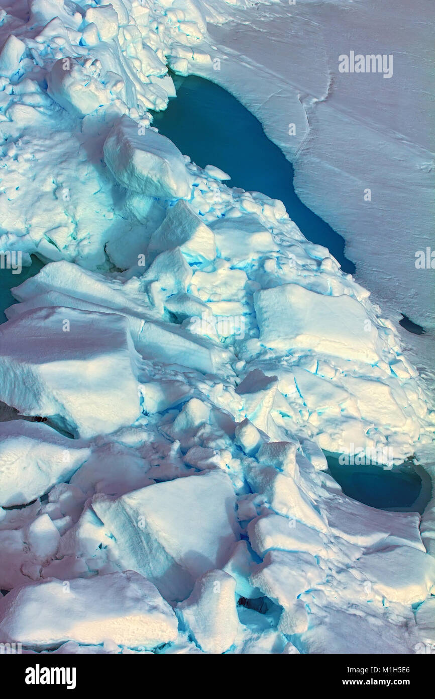 Ice reefing, hummocking. Big old toross intense blue color in cracks in ...