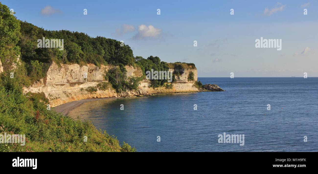 Pebbles beach limestone cliff hi-res stock photography and images - Alamy