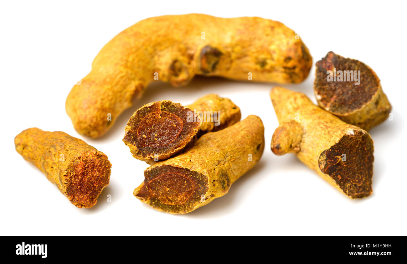 dried turmeric isolated on the white background Stock Photo - Alamy