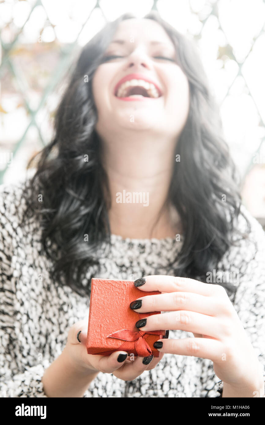 Excited beautiful woman gift hi-res stock photography and images - Alamy