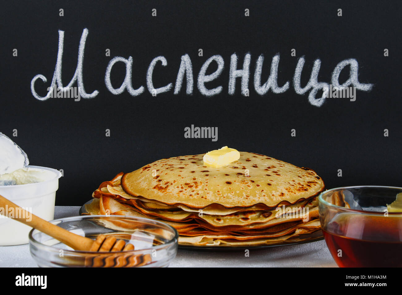 The inscription on a chalkboard in Russian: Maslenitsa. Traditional ...
