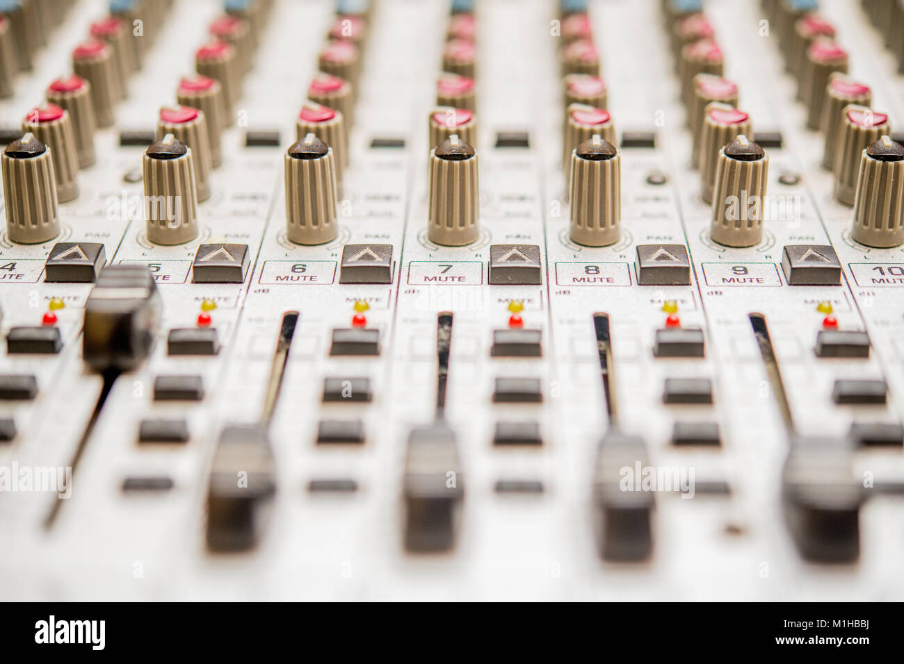 Macro close up of audio studio mixer knobs and levels short depth of ...