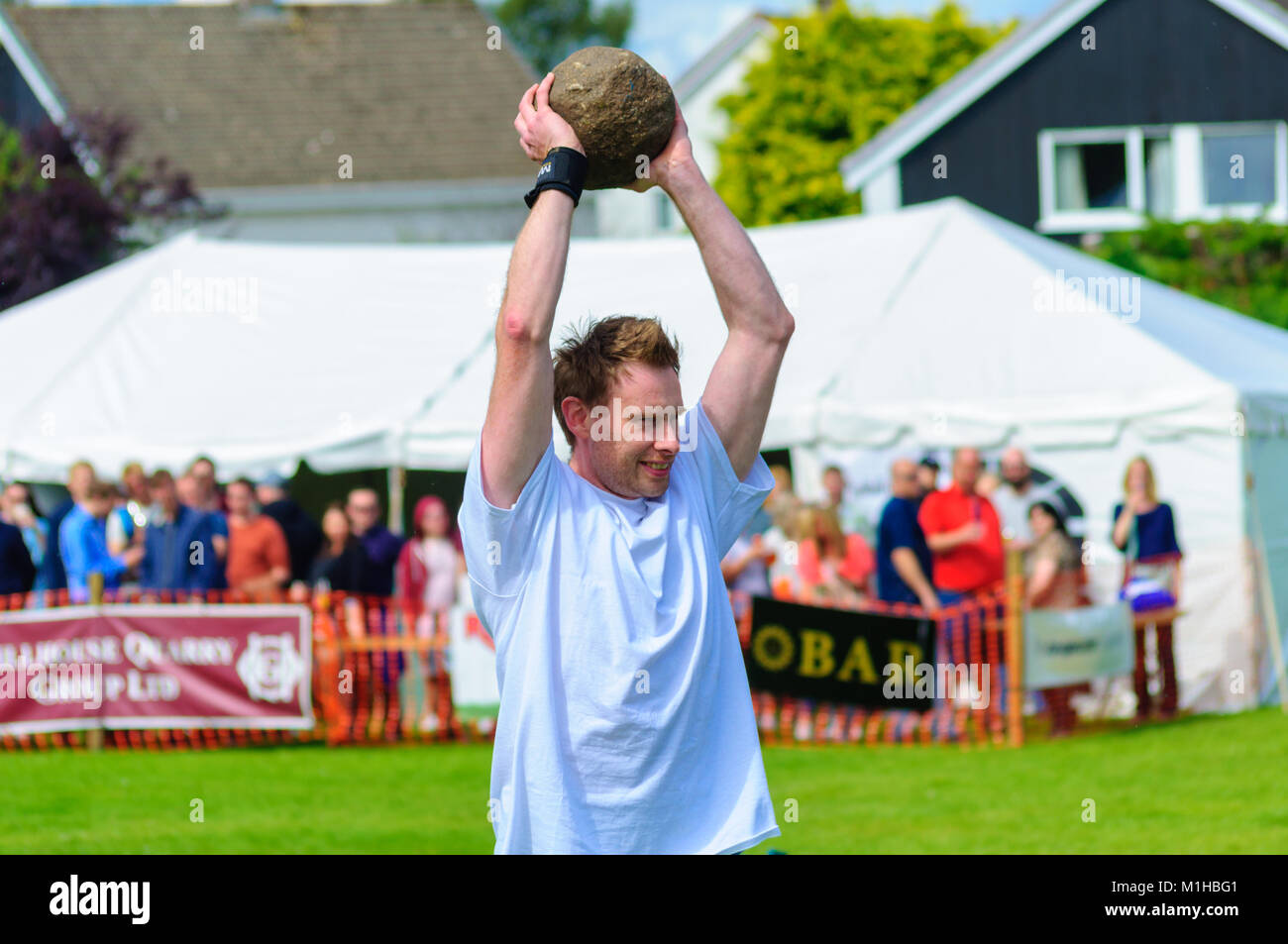 Muscular male prepares to throw in the stone put competition at the ...