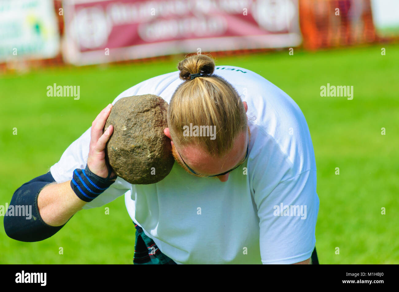 Stone put man throwing stone highland hi-res stock photography and ...