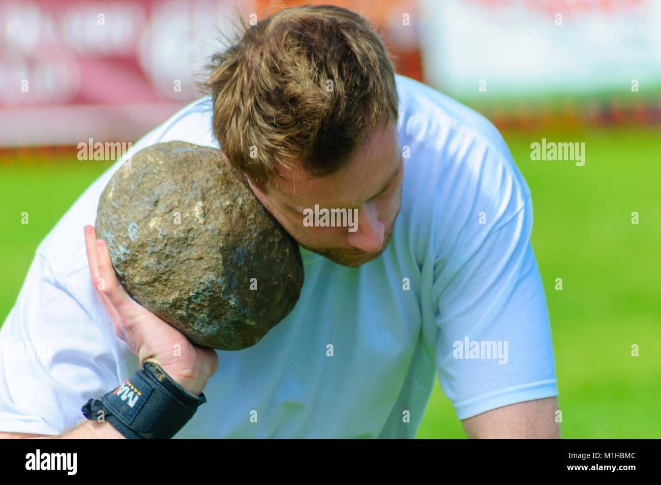 Muscular male prepares to throw in the stone put competition at the ...