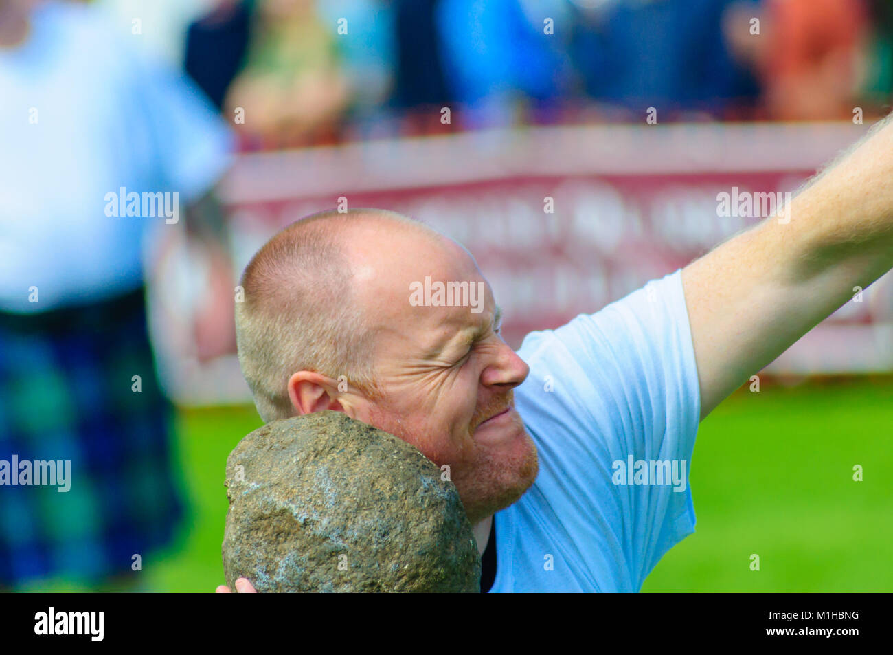 Muscular male prepares to throw in the stone put competition at the ...