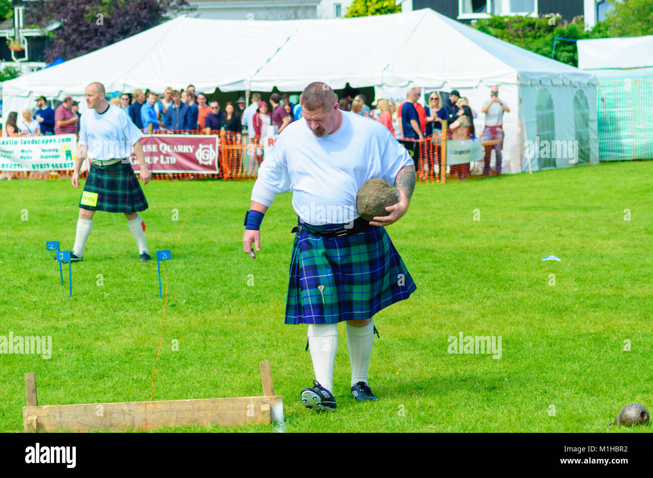 Muscular male prepares to throw in the stone put competition at the ...