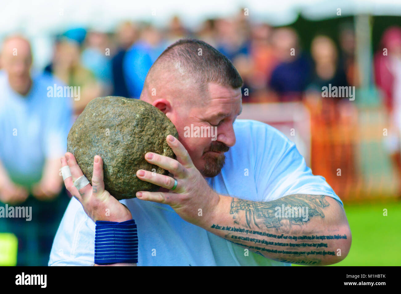 Muscular male prepares to throw in the stone put competition at the ...