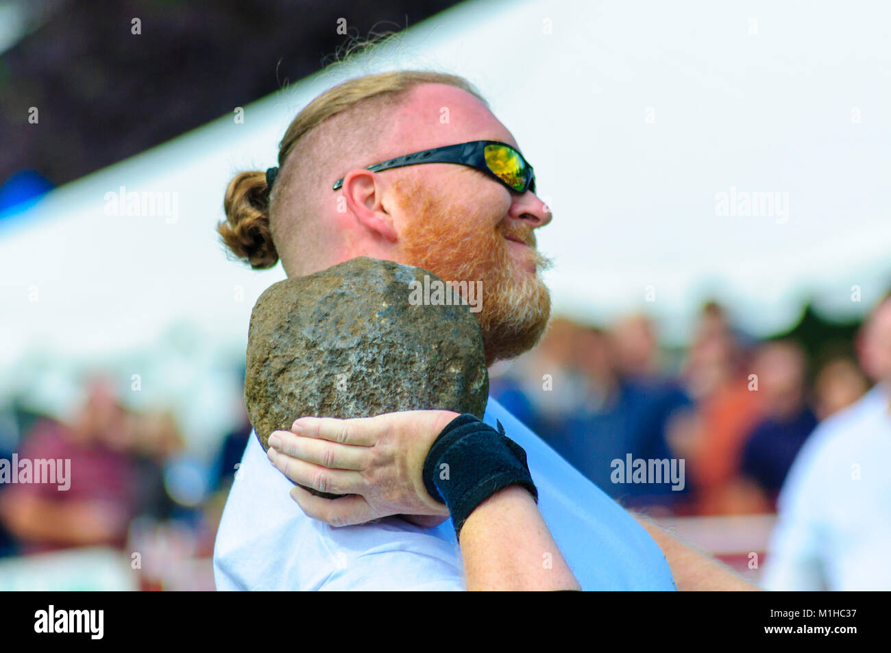 Stone put man throwing stone highland hi-res stock photography and ...