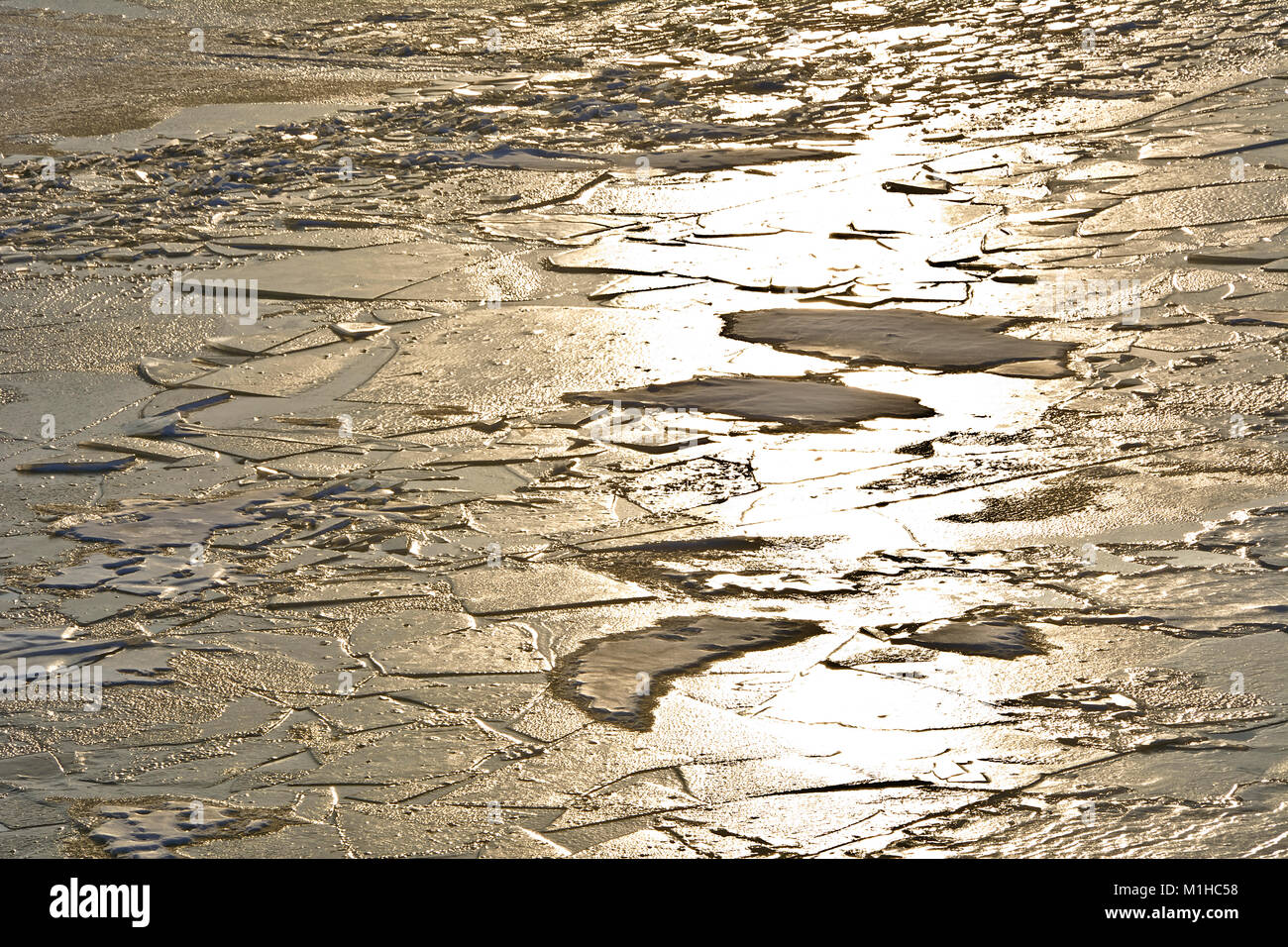 Broken ice on frozen pond hi-res stock photography and images - Alamy