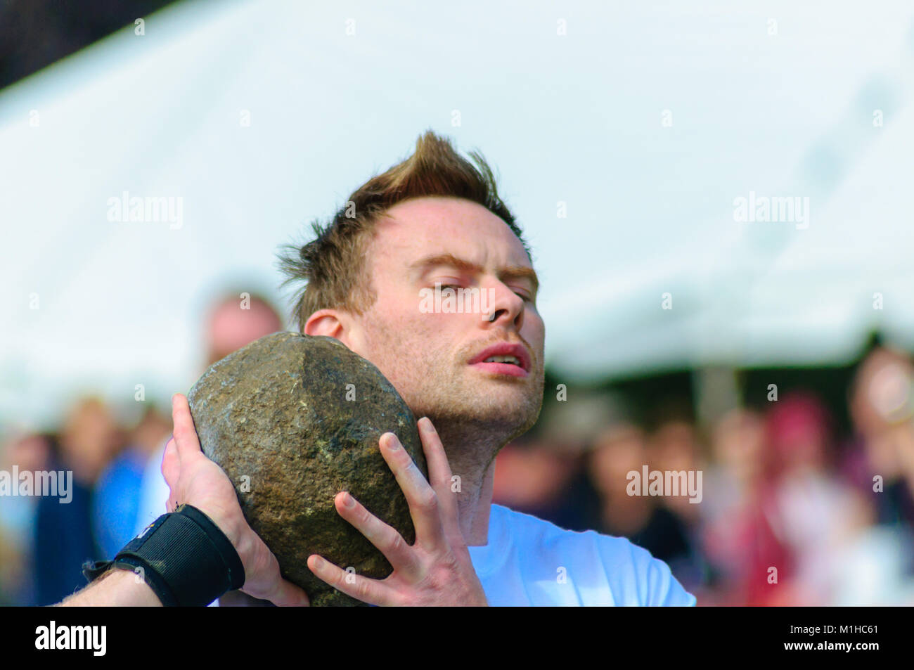 Muscular male prepares to throw in the stone put competition at the ...