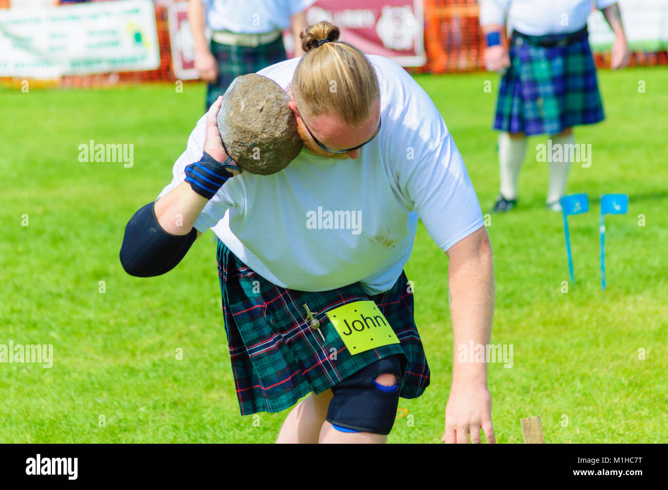 Muscular male prepares to throw in the stone put competition at the ...