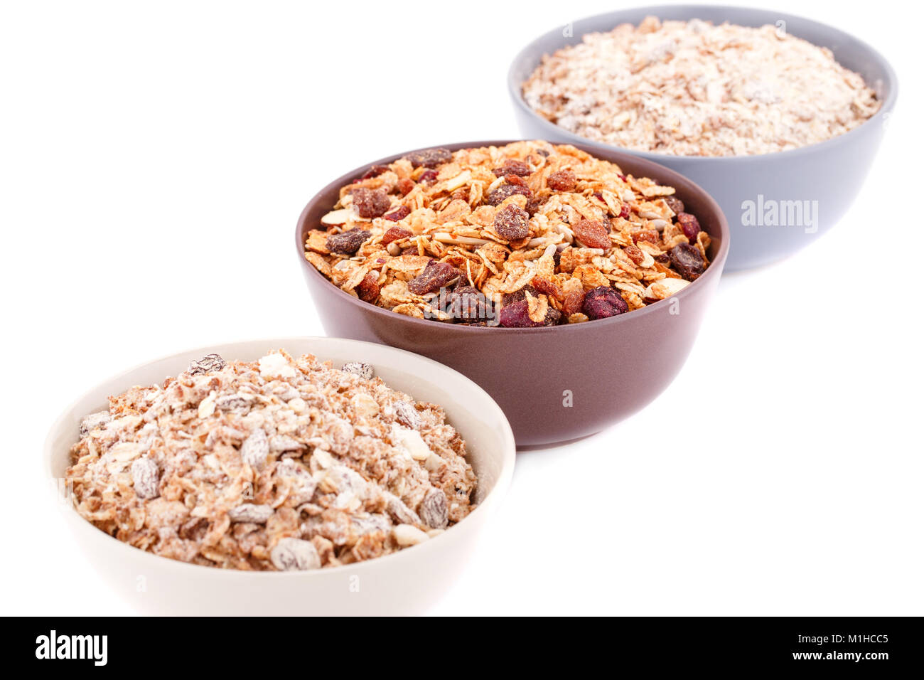 Musli in the bowl isolated on white background Stock Photo - Alamy