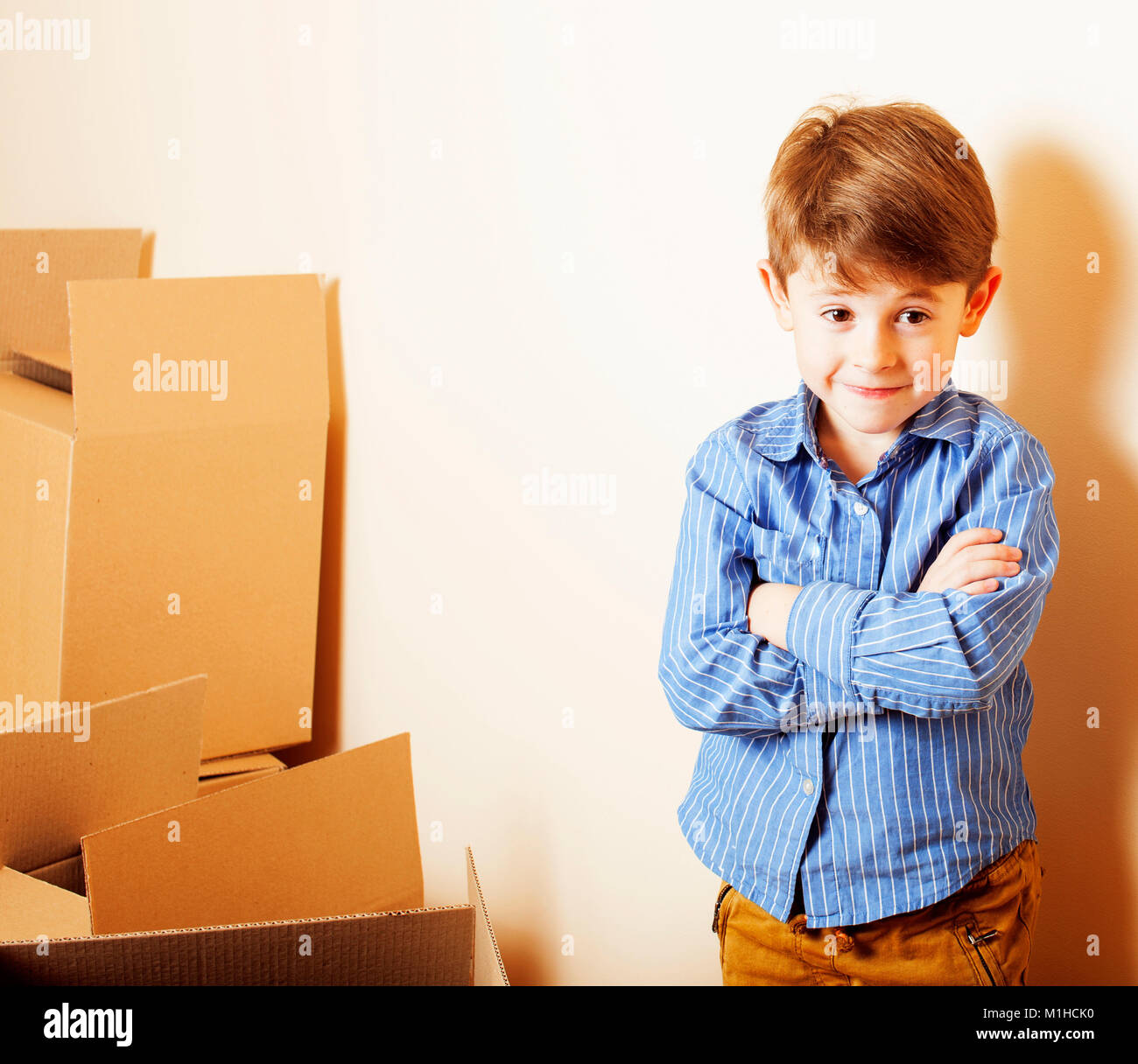 little cute boy in empty room, remoove to new house. home alone Stock ...