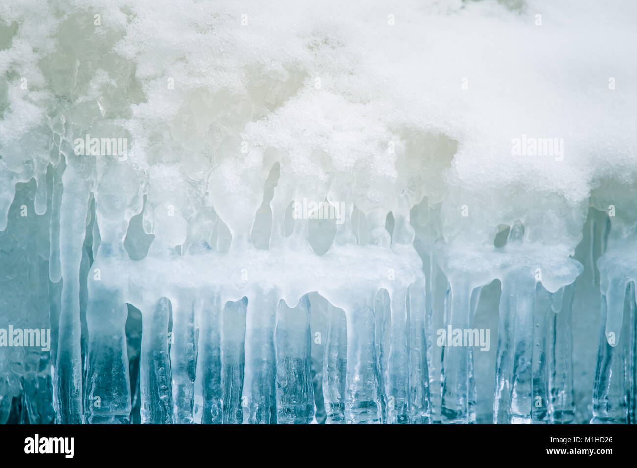A beautiful frozen icicles at the bank of river in Latvia. Beautiful ...