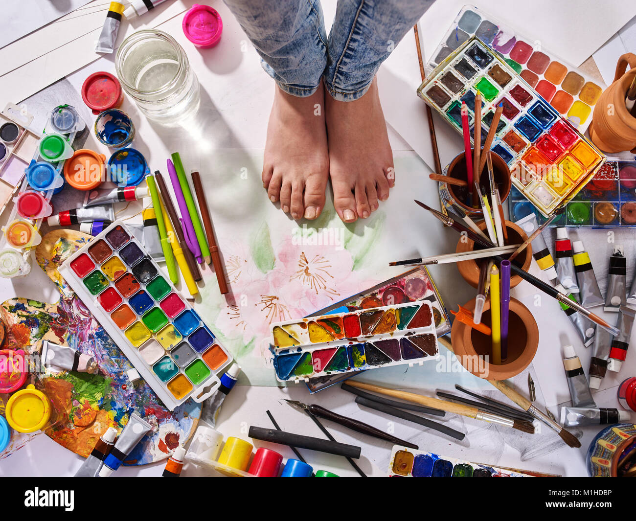 Authentic paint brushes still life on floor in art class school. Group ...